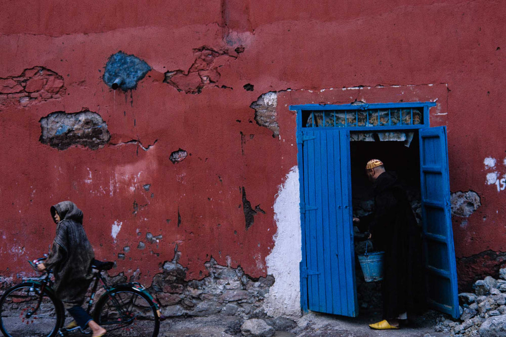 Man in Blue Doorway and Young Boy on Bike, Marrakech – Jay Maisel