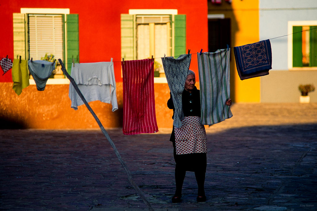 Woman in Street with Laundry, Burano – Jay Maisel