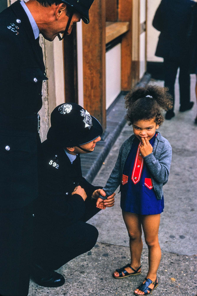 Two Bobbies with Young Girl, London – Jay Maisel