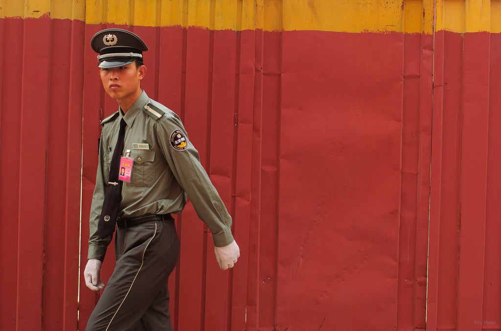 Policeman Walking, Beijing – Jay Maisel