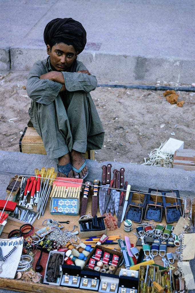 Boy with Turban and Merchandise, Abu Dhabi – Jay Maisel