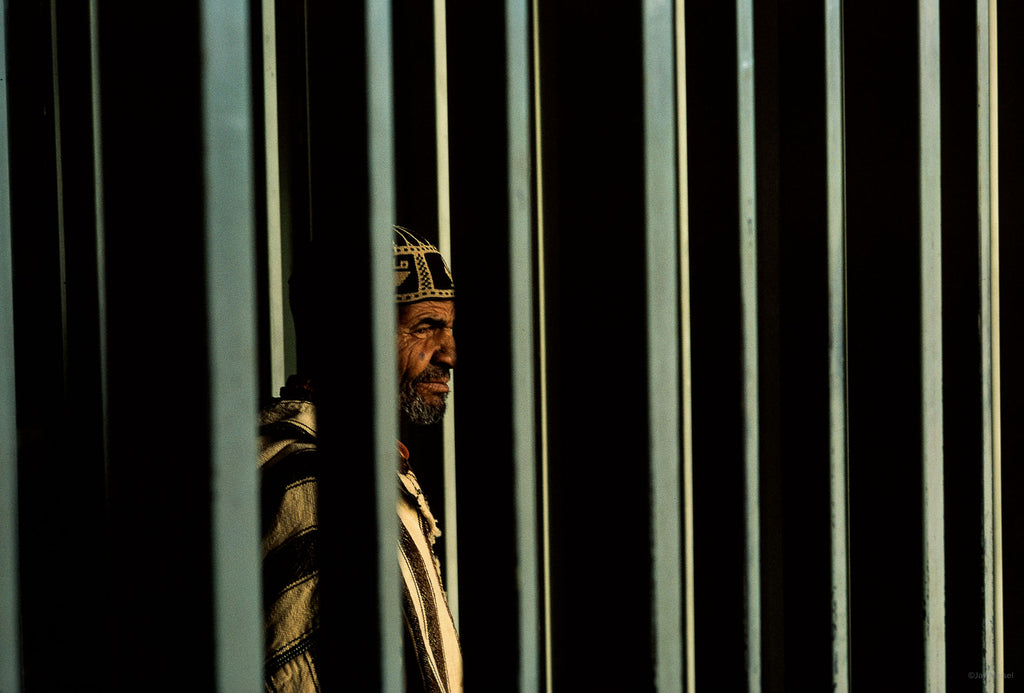 Man through Vertical Posts, Marrakech – Jay Maisel
