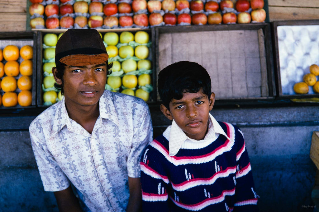 Two Boys with Display of Fruits, Mauritius – Jay Maisel