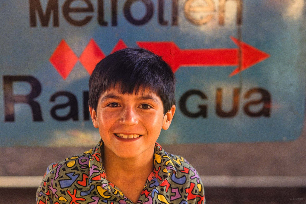 Boy and Sign, Chile – Jay Maisel