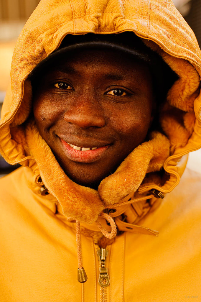 Younger Man in Yellow Smiling, NYC – Jay Maisel
