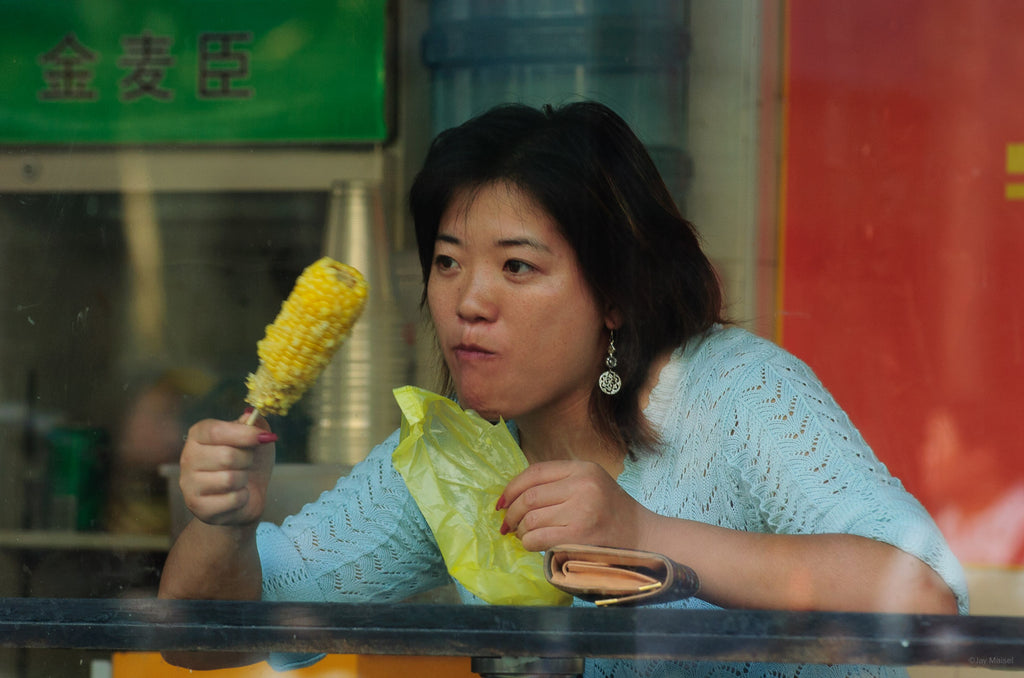 Woman with Ear of Corn, Shanghai – Jay Maisel